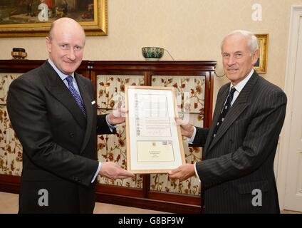 The Queen's private secretary Sir Christopher Geidt (second left) is ...