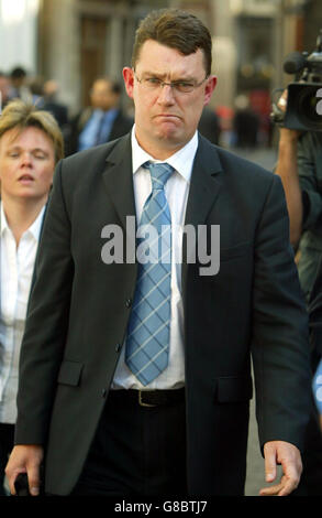 Giles Van Colle's father, Irwin, and his wife Corinne, read a statement ...