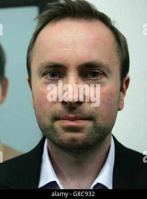Dean Marsh, winner of the 2005 BP Portrait Award, stands before the ...