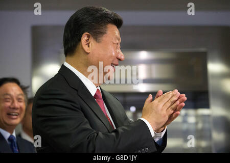 China's President Xi Jinping is shown the way during a welcome ceremony ...