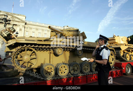 A police officer takes a look at a German Panzer III tank parked ...