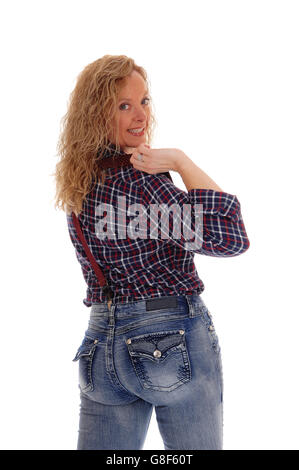 Middle age woman standing over white background doing bunny ears ...