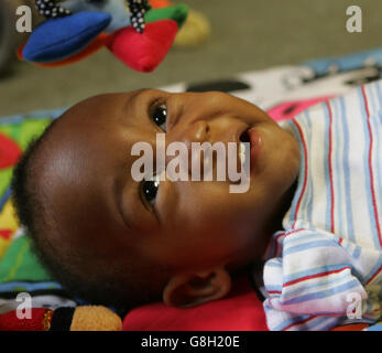 Freddie Mtile, who has no arms or legs, with Fiona Carnegie, a Senior ...