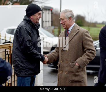 The Prince of Wales meets Barry Cookson (second left) as he visits ...