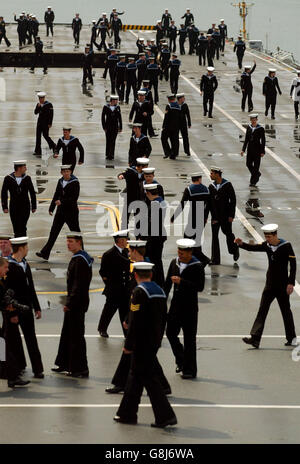 The crew of the former flagship of the Royal Navy HMS Invincible ...