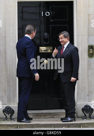 Turkish Prime Minister Ahmet Davutoglu sings the national anthem at the ...