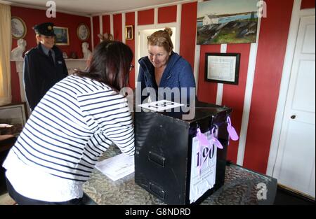 Garda Margaret Byrne (left) and presiding officer Majella Harkin carry ...