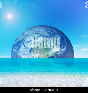 Planet emerging from the sea. Elements provided by NASA Stock Photo - Alamy