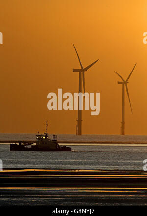 The wind turbines can be seen from the beach. Weybourne beach and ...