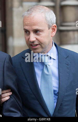 Ocado chief executive Tim Steiner (right) leaves The Royal Courts of ...