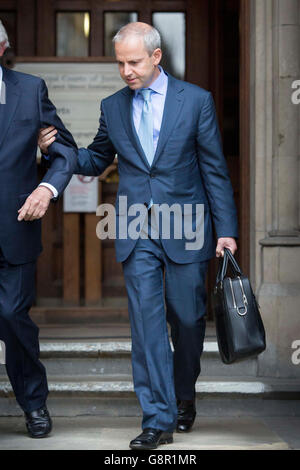 Ocado chief executive Tim Steiner (right) leaves The Royal Courts of ...
