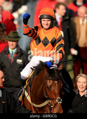 Jockey Tom Scudamore celebrates winning the Ryanair World Hurdle on ...