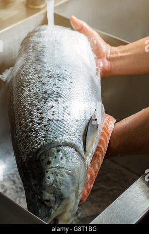 Japanese man washing hands in the kitchen Stock Photo - Alamy