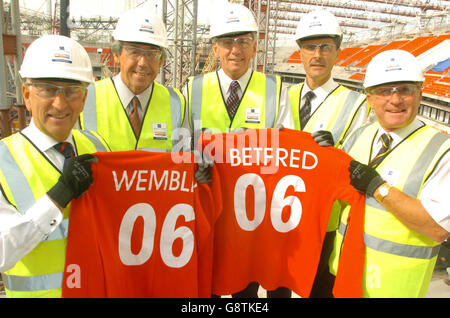 Betfred founder and chairman Fred Done (centre) shake hands with ...
