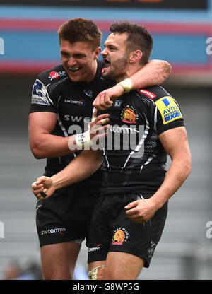 Exeter Chiefs' Henry Slade (right) is tackled by Bath's Finn Russell ...