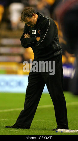 Wolverhampton Wanderers' manager Glenn Hoddle (L) watches with coach ...