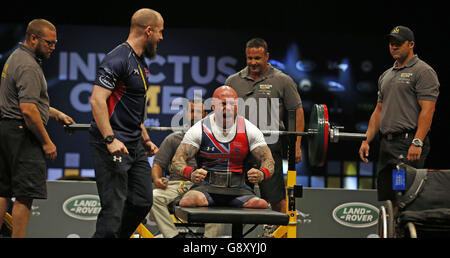 Lightweight weightlifter Michael Yule celebrates after he became the ...