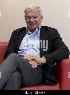 WestJet Airlines President & CEO Gregg Saretsky holds a model of the ...