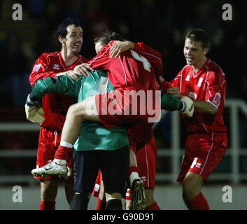 Rushden & Diamonds' goalkeeper Jamie Young (L) celebrates with team ...