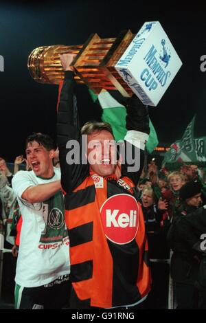 Ronald Unger the SV Keli Ried captain holds up the Memphis Cup Trophy ...