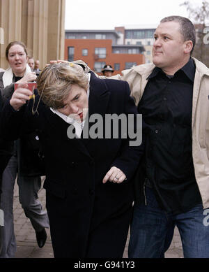 Education Secretary Ruth Kelly ducks after being hit by an egg outside ...