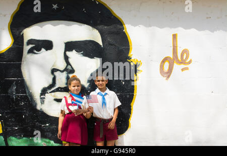 Las Terrazas Cuba elementary school student with American and Cuban flag and Che mural on wall ...