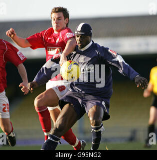 Walsall's Andrew Barrowman (L) challenges Southend's Luke Guttridge ...