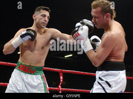 England's Mehrdud Takaloo (L) in action against Germany's Turgay Uzun ...