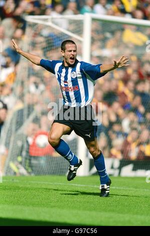 Sheffield Wednesday's Gilles De Bilde (l) puts Wimbledon's Duncan Jupp ...