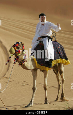 Sir Richard Branson rides a camel in the Dubai desert on Wednesday ...