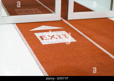 Emergency exit sign at airport, Terminal 5, Heathrow airport, London ...