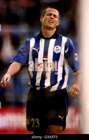Sheffield Wednesday's Gilles De Bilde (l) puts Wimbledon's Duncan Jupp ...