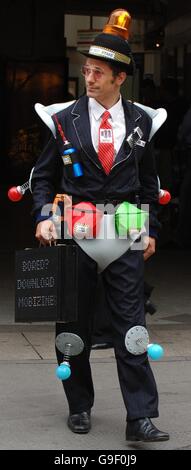 Conceptual artist Liam Yates wears his Commute Suit creation outside ...