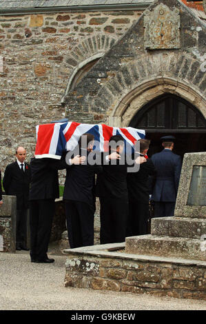 Fellow RAF personnel support each other at the funeral of Ft Lt Gareth ...