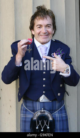 Glasgow's Radio Clyde DJ Tiger Tim Stevens proudly shows off his MBE in ...