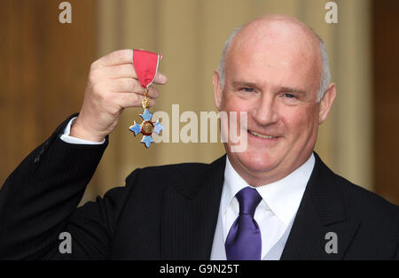 Head of EMI Eric Nicoli outside Buckingham Palace after receiving a CBE ...