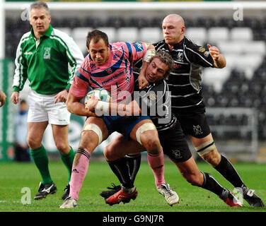 Stade Francais Sergio Parisse, right, is tackled by Clermont's Damien ...