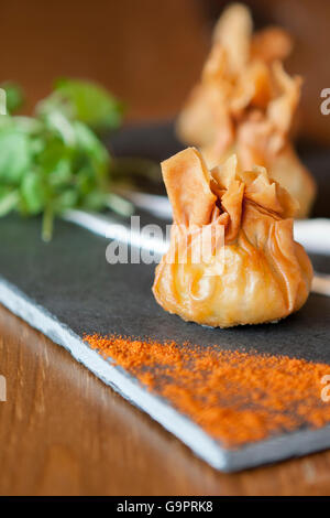 A starter of food on a slate plate Stock Photo - Alamy