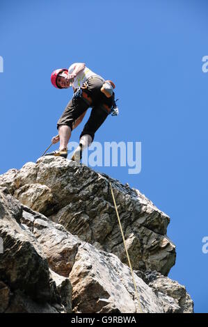 People abseiling in rock climbing lesson Stock Photo - Alamy