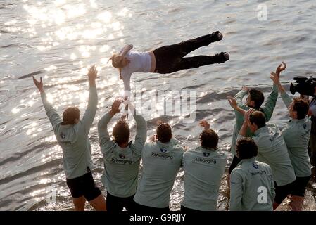 Cambridge University throw their cox Rebecca Dowbiggin into the water ...