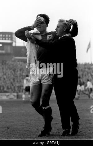 Nottingham Forest trainer Tommy Cavanagh (r) helps Frank Wignall (l ...