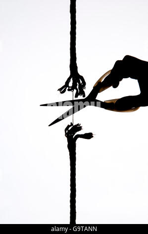 cutting a rope with a knife Stock Photo - Alamy