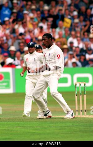 England's Alex Tudor celebrates taking the wicket of Australia's ...