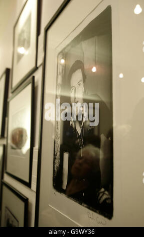 Guests study the prints at private view of the photographs of music ...