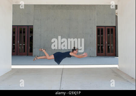 pretty teen girl floating in an inflatable raft on a lake in Stock ...