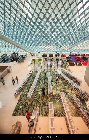 Interior view of Seattle Central Library with sloped glass roof ...