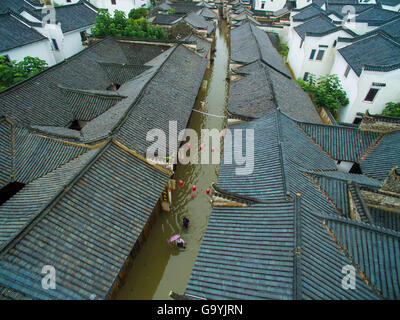 Tongcheng, China's Anhui Province. 4th July, 2016. Local villagers row ...