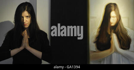 Randolph Gallery owner Margaret Bruce (right), looks at a piece of work ...