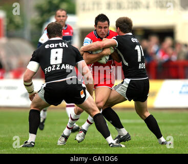 Hull Kingston Rovers' Nick Fozzard tackles Celtic Crusaders' Darren ...