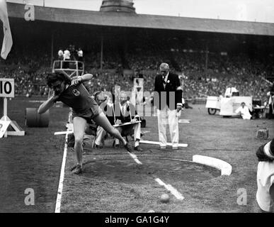 France's Micheline Ostermeyer putting the shot, an event in which she ...